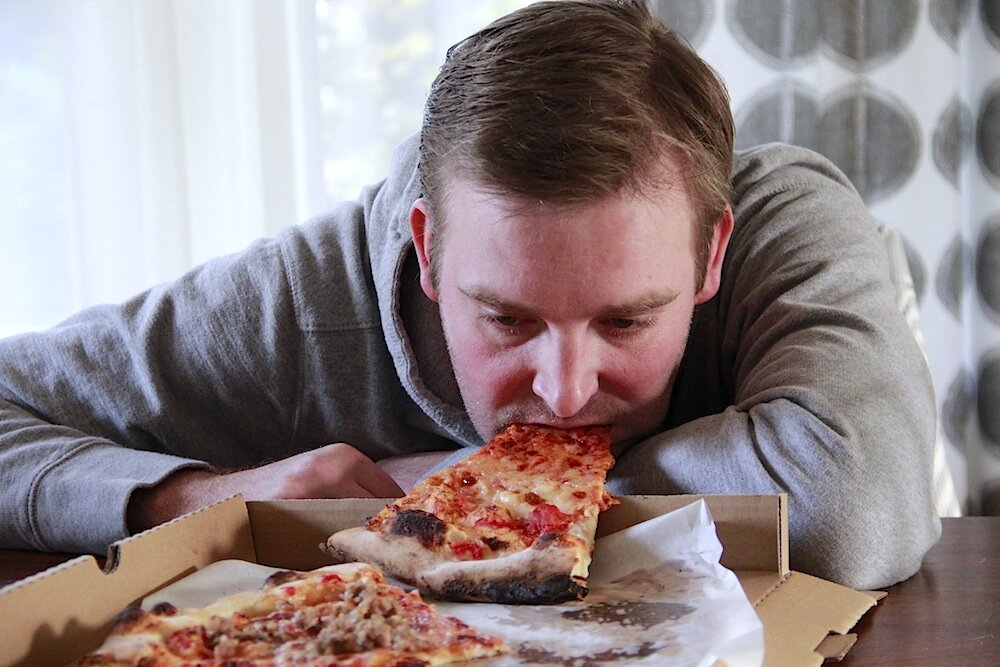 Man Eating Pizza