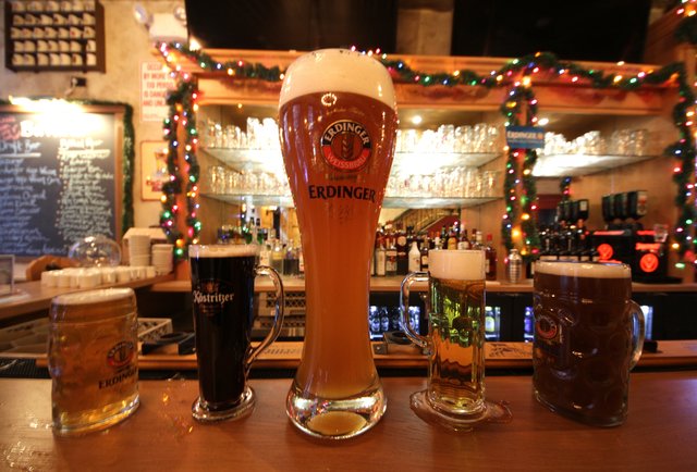 3-liter steins in a German beer mansion Downtown - Thrillist NY