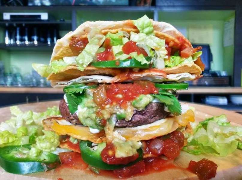PYT Taco Bun Burger sandwiches a beef patty between two whole tacos ...
