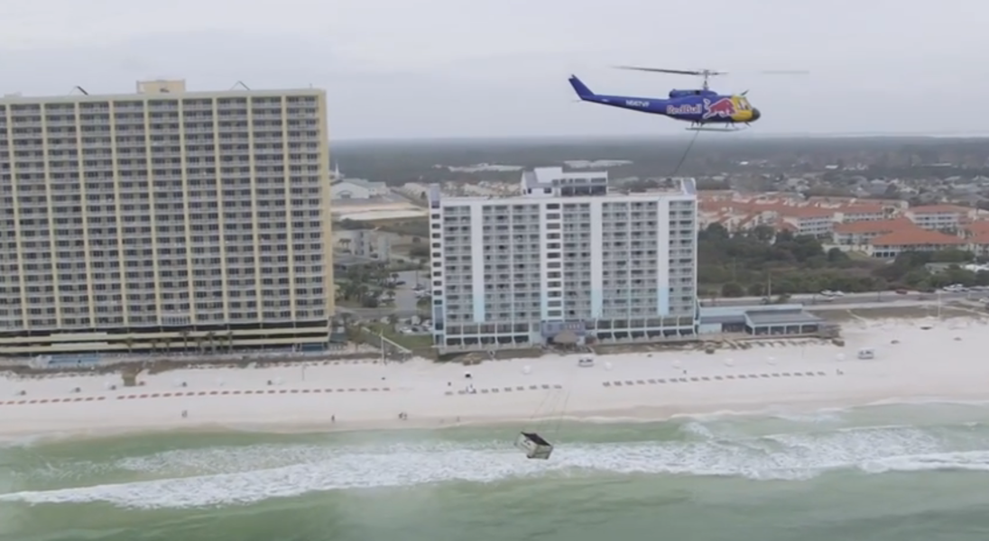 Watch a Helicopter Air Drop Thousands of Red Bull Cans on Panama City ...