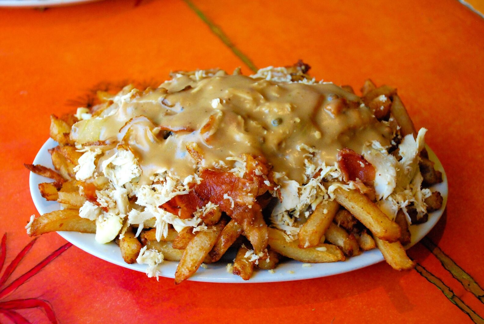 How to Make True Poutine: Fries, Cheese & Gravy - Thrillist