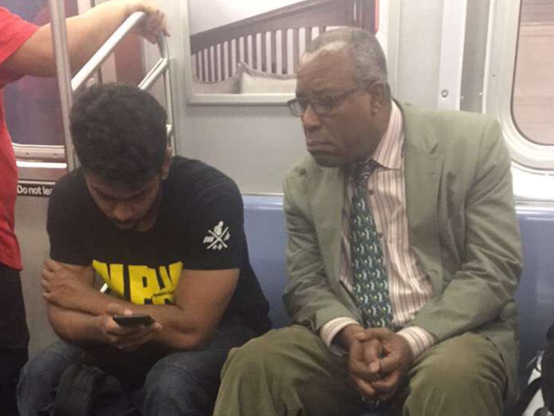Man on NYC Subway Can't Stop Snooping on People's Phones - Thrillist