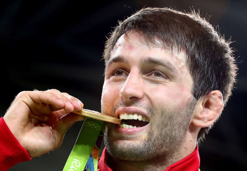 Why Do Olympians Bite Their Gold Medals? Olympics Tradition Explained ...