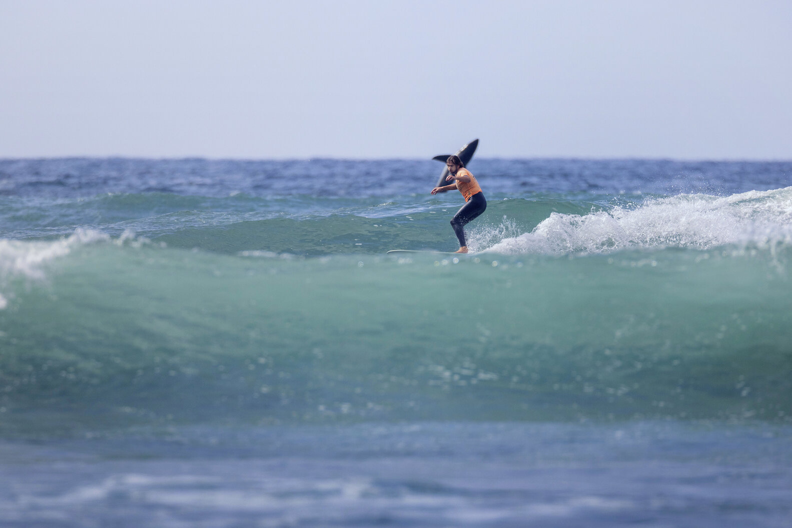 Surfer Focused On Winning Competition Has No Idea Who’s Right Behind ...