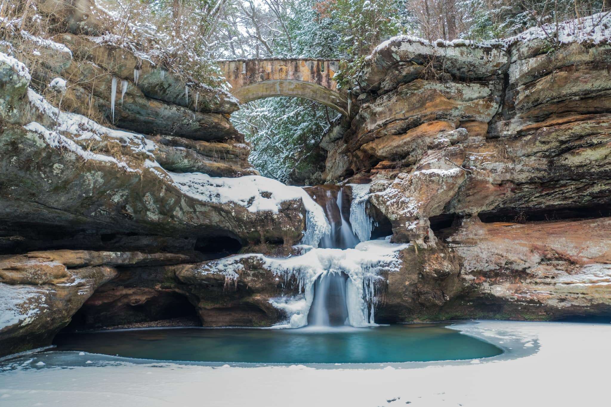 Waterfall And Arched Bridge At Hocking Hills State Park Of Ohio
